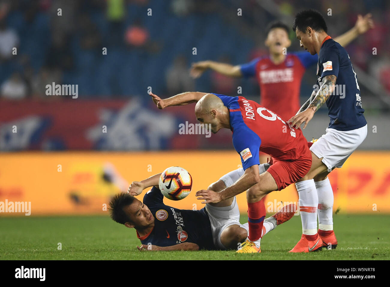 Polish football player Adrian Mierzejewski, center, of Chongqing?SWM ...