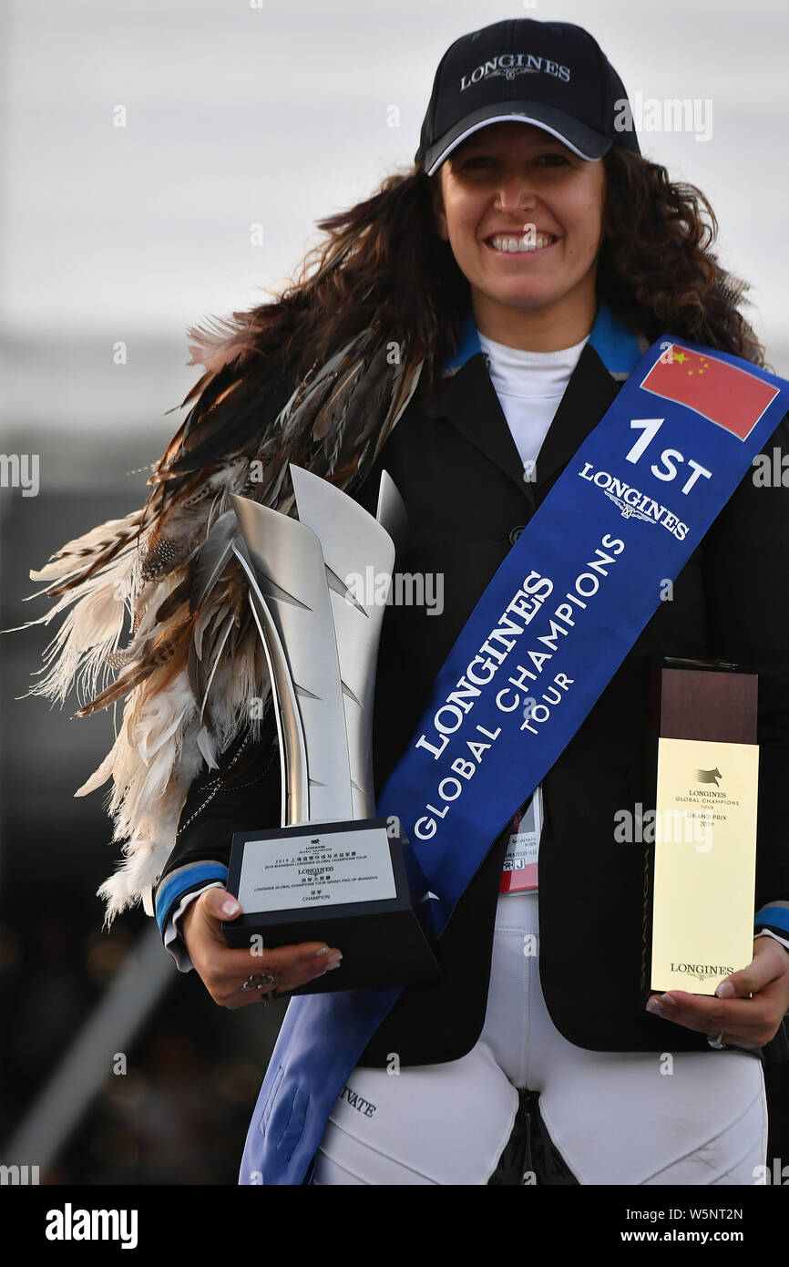 Danielle Goldstein poses with her trophy at the award ceremony after ...