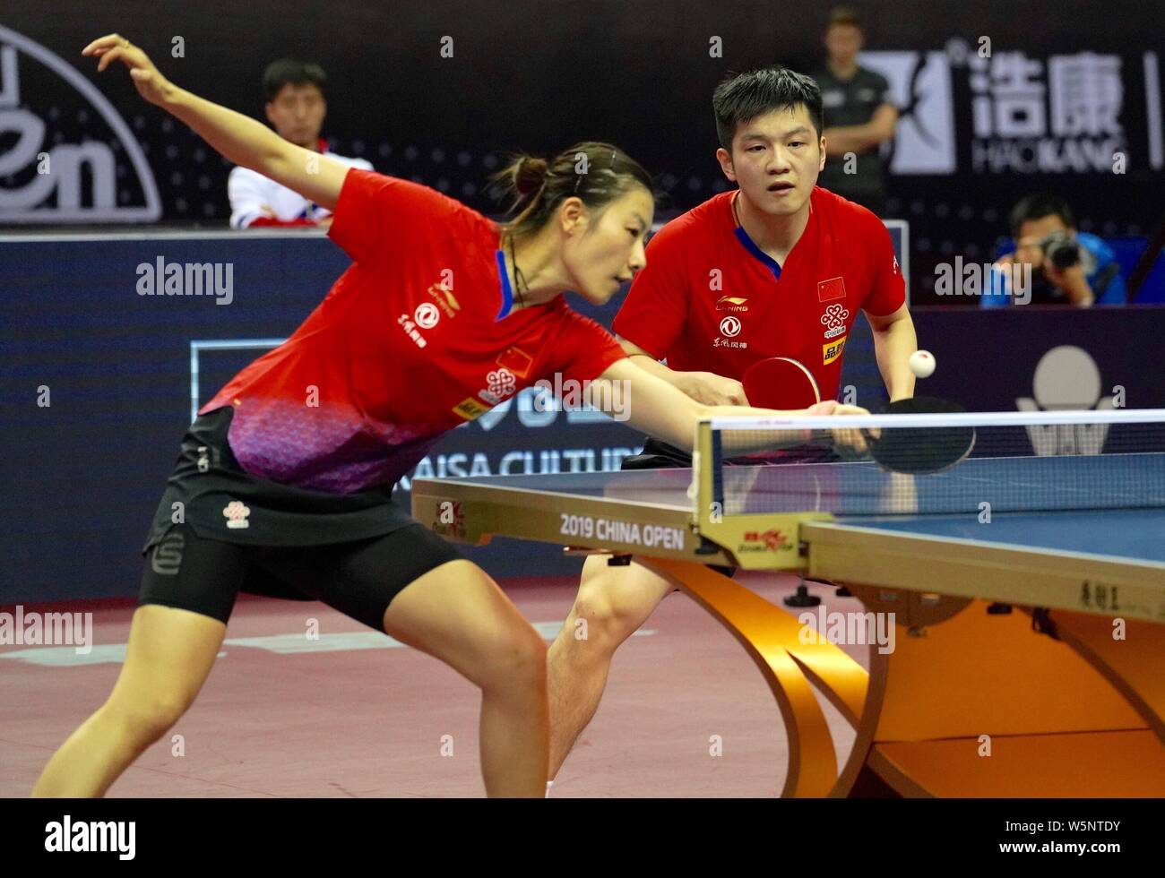 Fan Zhendong and Ding Ning of China return a shot to An Ji Song and Kim ...
