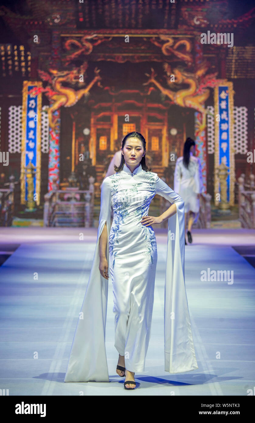 A model dressed in Cheongsam, a traditional Chinese dresses also known ...