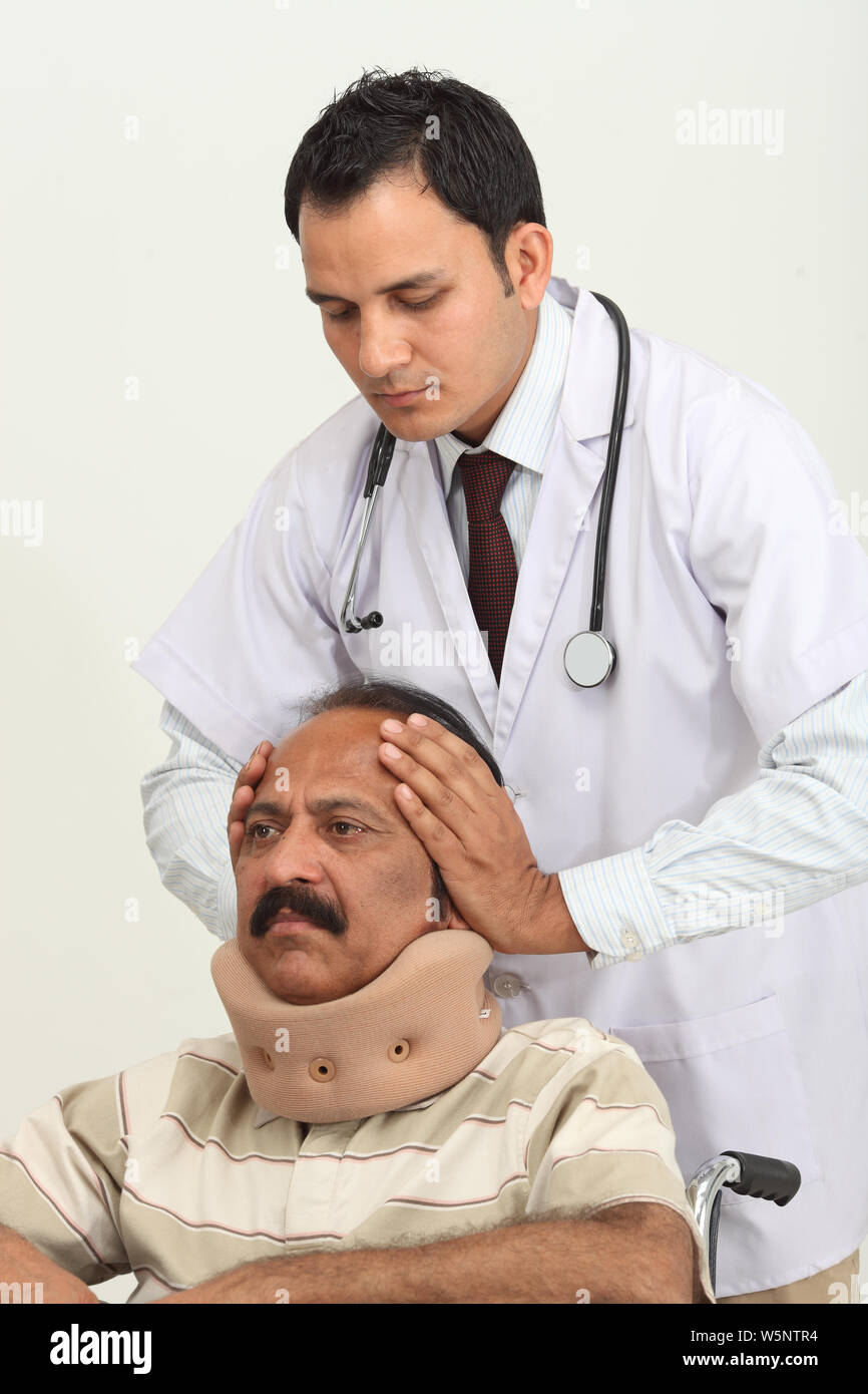 Male doctor massaging patient head Stock Photo - Alamy