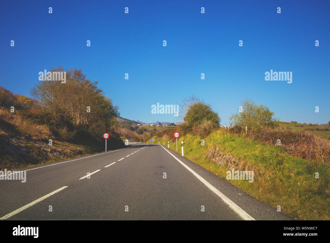 Driving a car on a highway. View from the windscreen of landscape with ...
