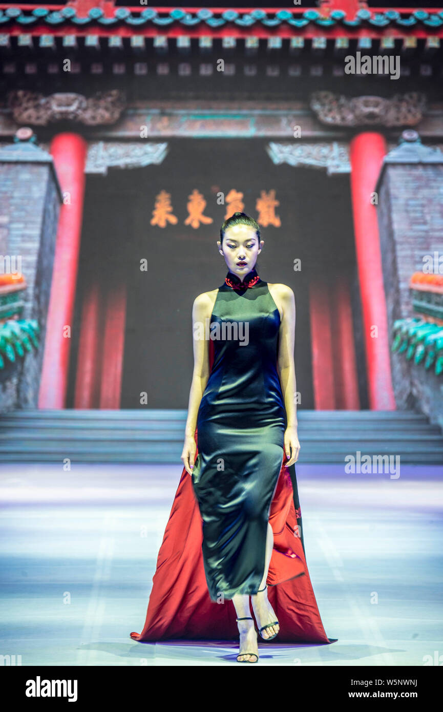 A model dressed in Cheongsam, a traditional Chinese dresses also known ...