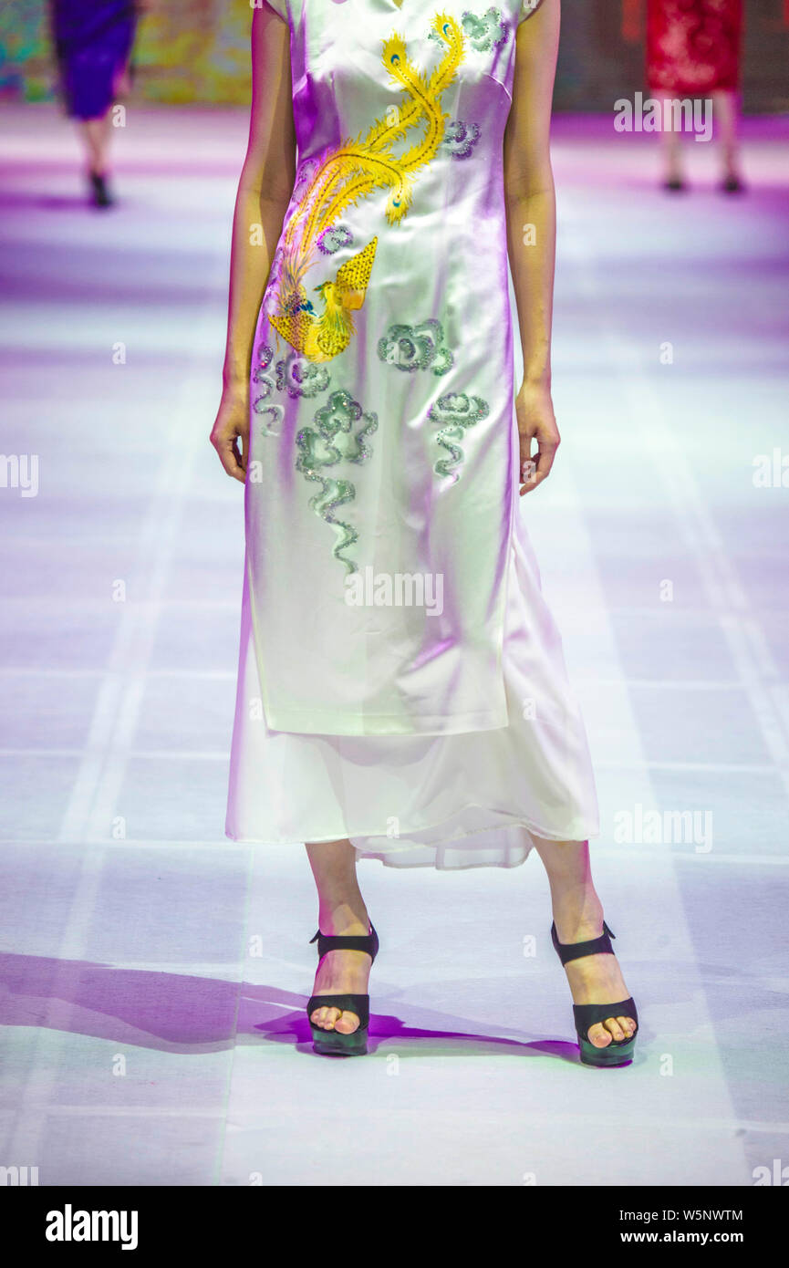 A model dressed in Cheongsam, a traditional Chinese dresses also known ...