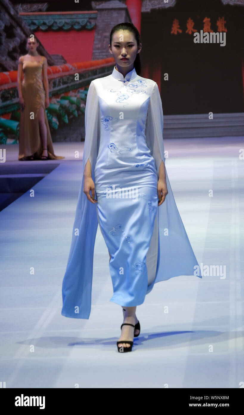 A model dressed in Cheongsam, a traditional Chinese dresses also known ...