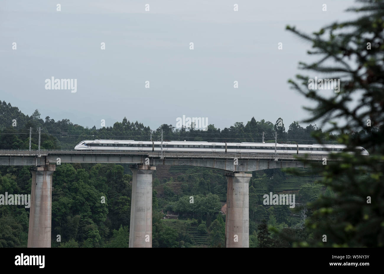 --FILE--A CRH (China Railway High-speed) bullet train runs on the ...