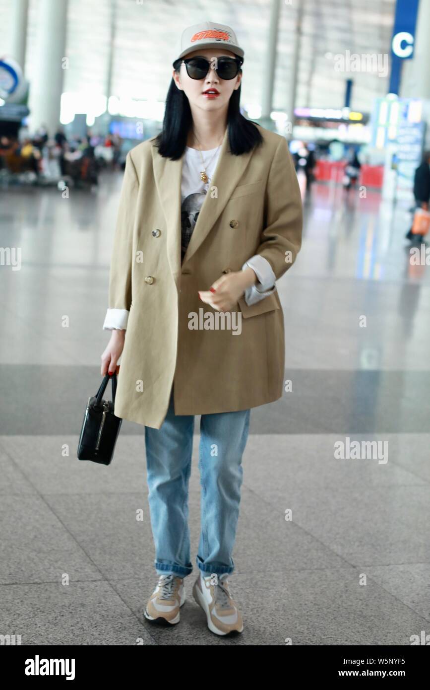 Chinese actress Jing Tian arrives at the Beijing Capital International ...