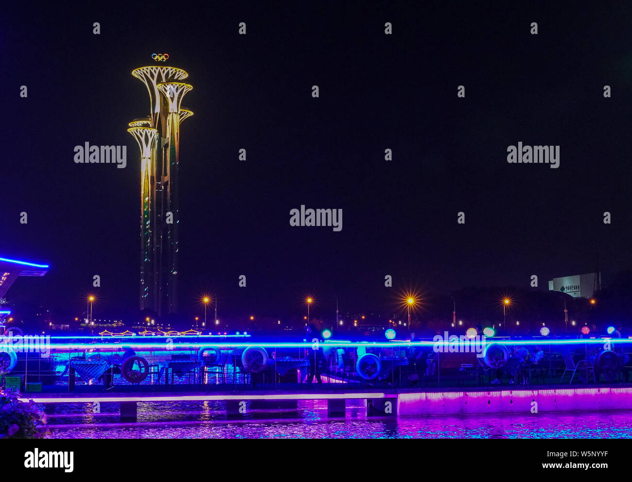 The watchtower at Olympic Forest Park is illuminated by colorful lights ...