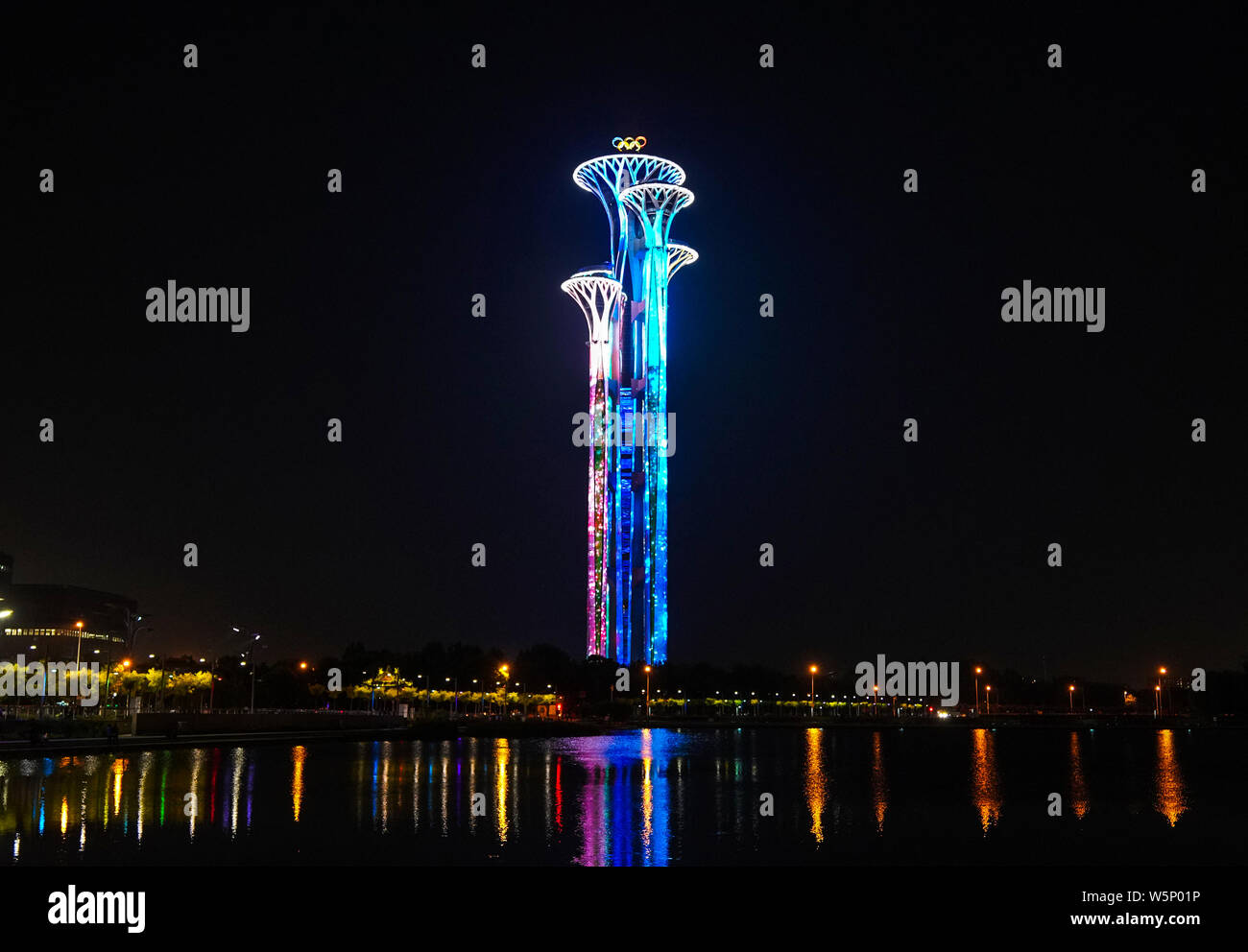 The watchtower at Olympic Forest Park is illuminated by colorful lights ...