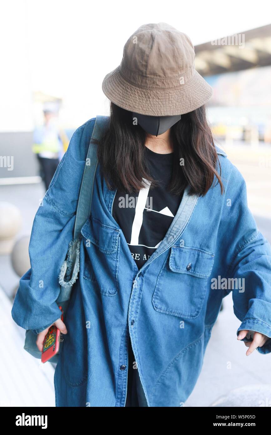 Chinese actress Ni Ni arrives at the Beijing Capital International ...