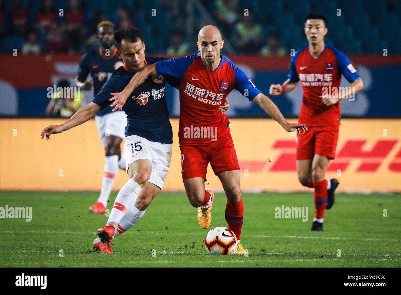 Polish football player Adrian Mierzejewski, right, of Chongqing?SWM ...
