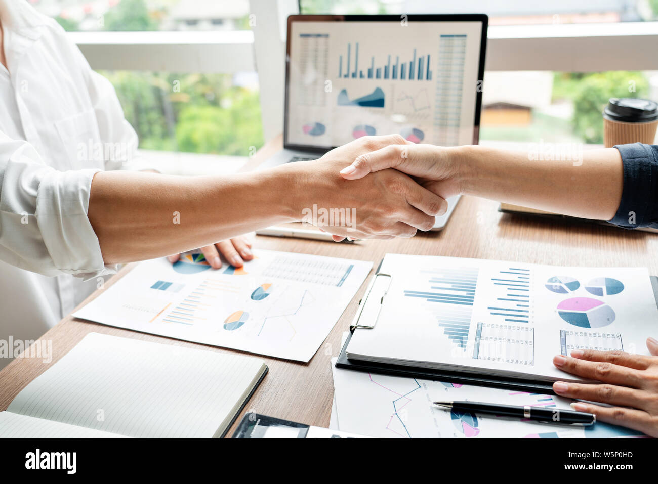 Business handshake after agreement meeting or negotiation finishing up ...