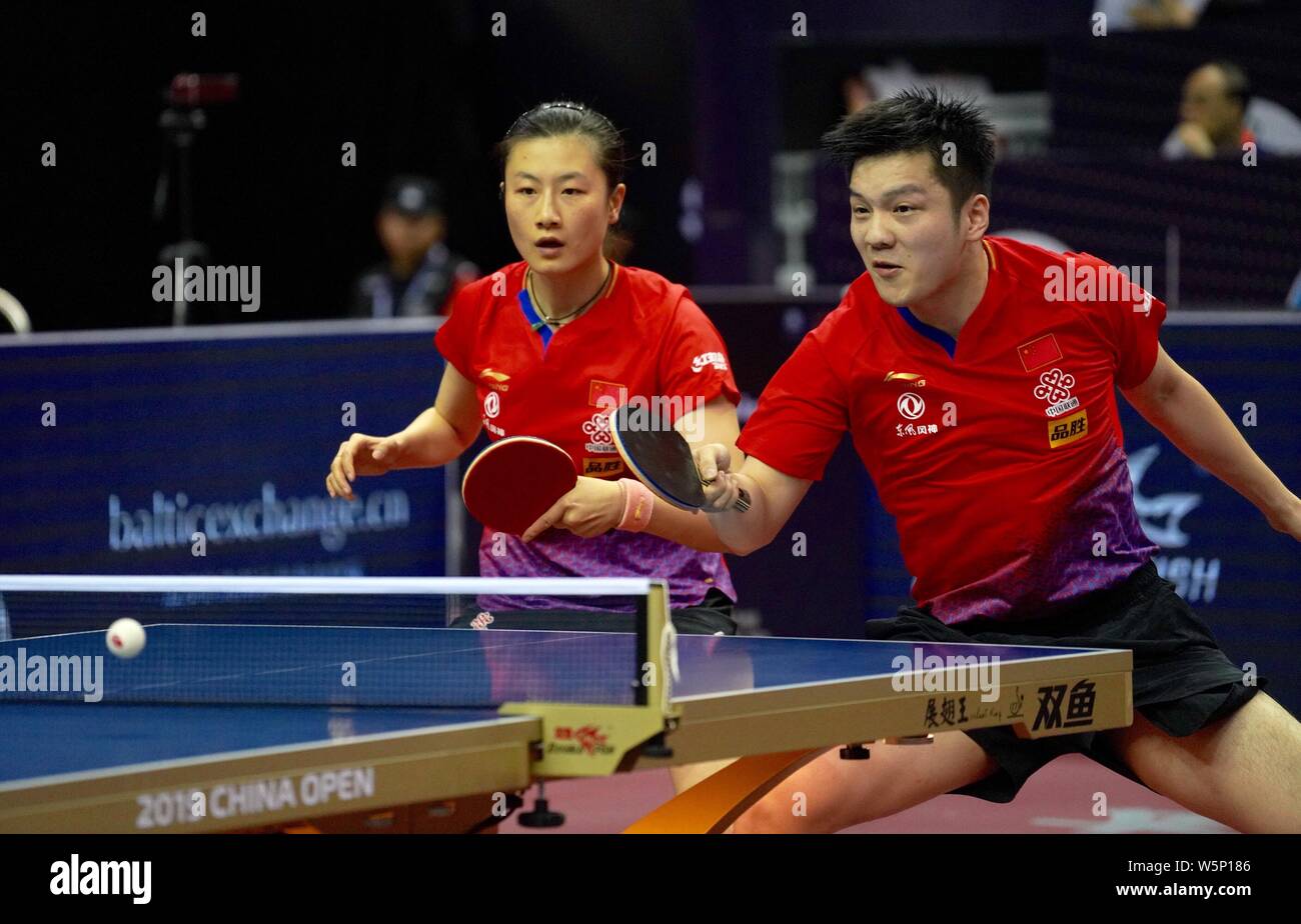 Fan Zhendong and Ding Ning of China return a shot to An Ji Song and Kim ...
