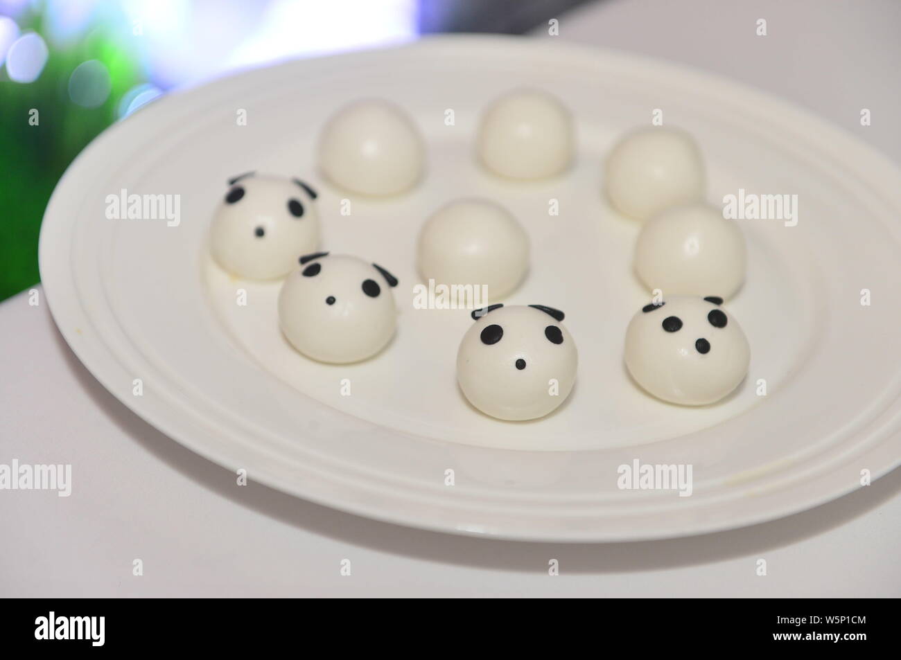 Desserts featuring shape of giant panda are served for visitors during ...