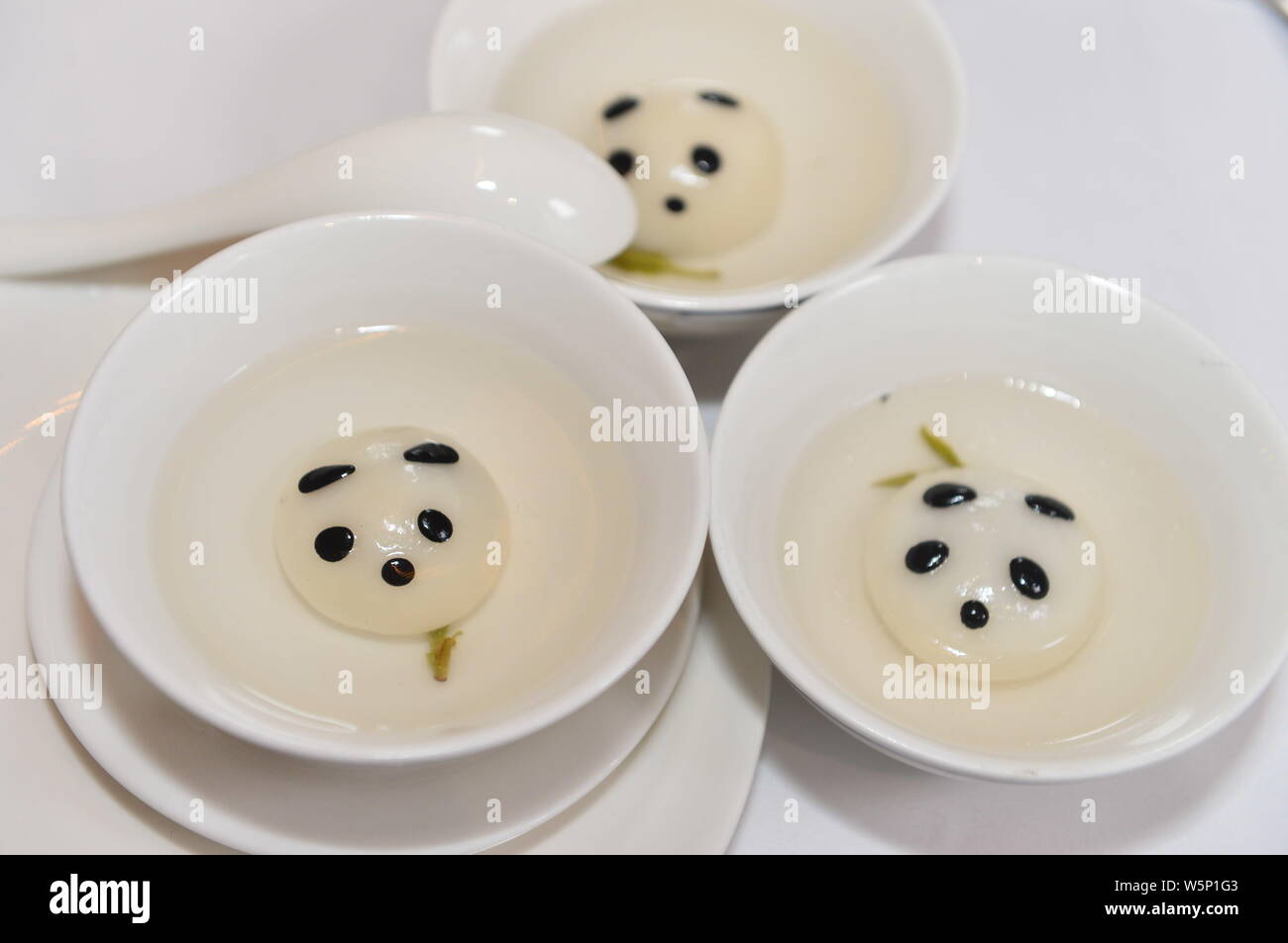Desserts featuring shape of giant panda are served for visitors during ...