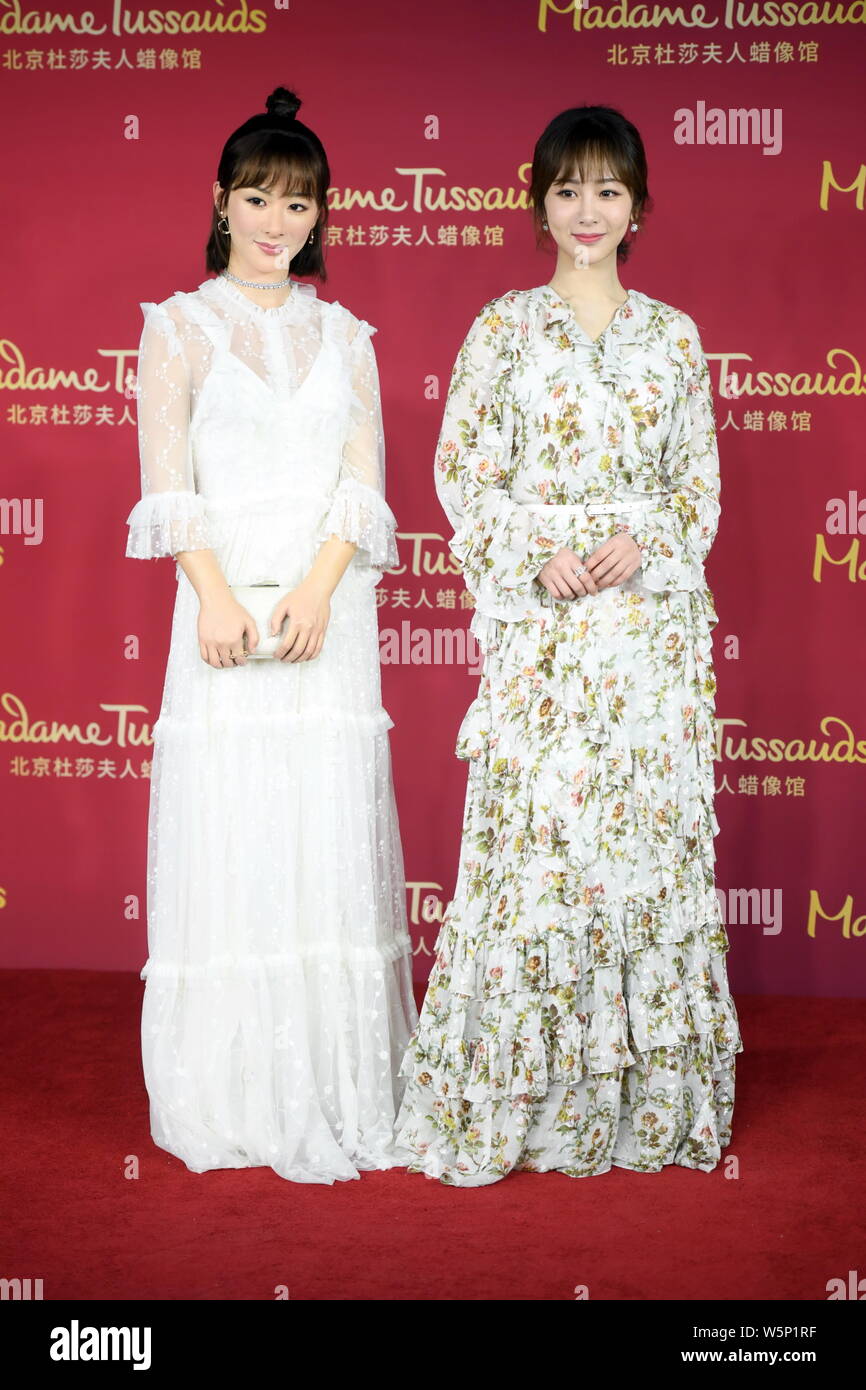 Chinese actress Andy Yang or Yang Zi poses with the wax figure of her ...