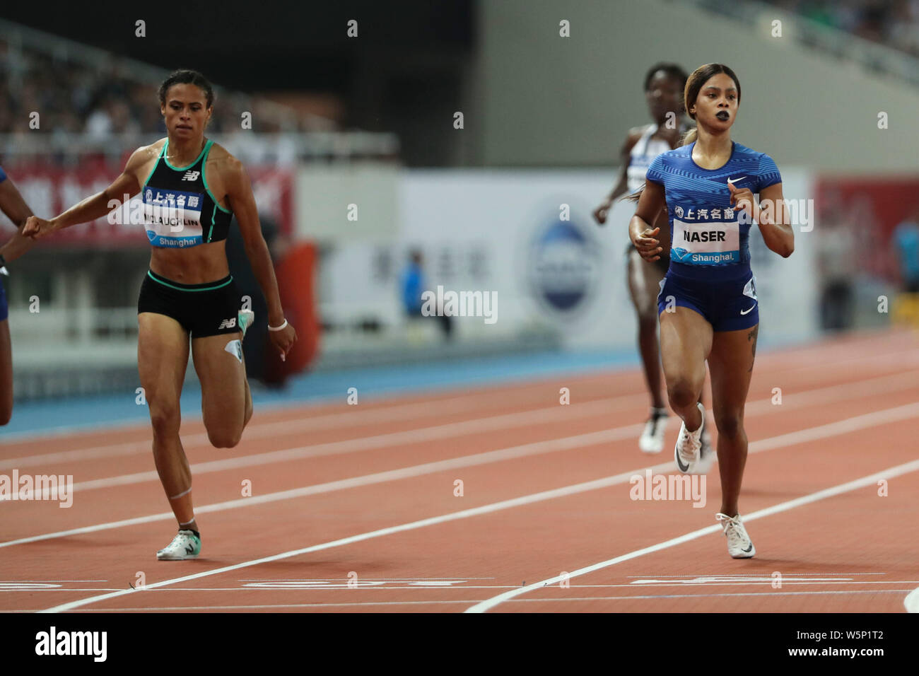 Bahraini track and field sprinter Salwa Eid Naser, right, competes in ...