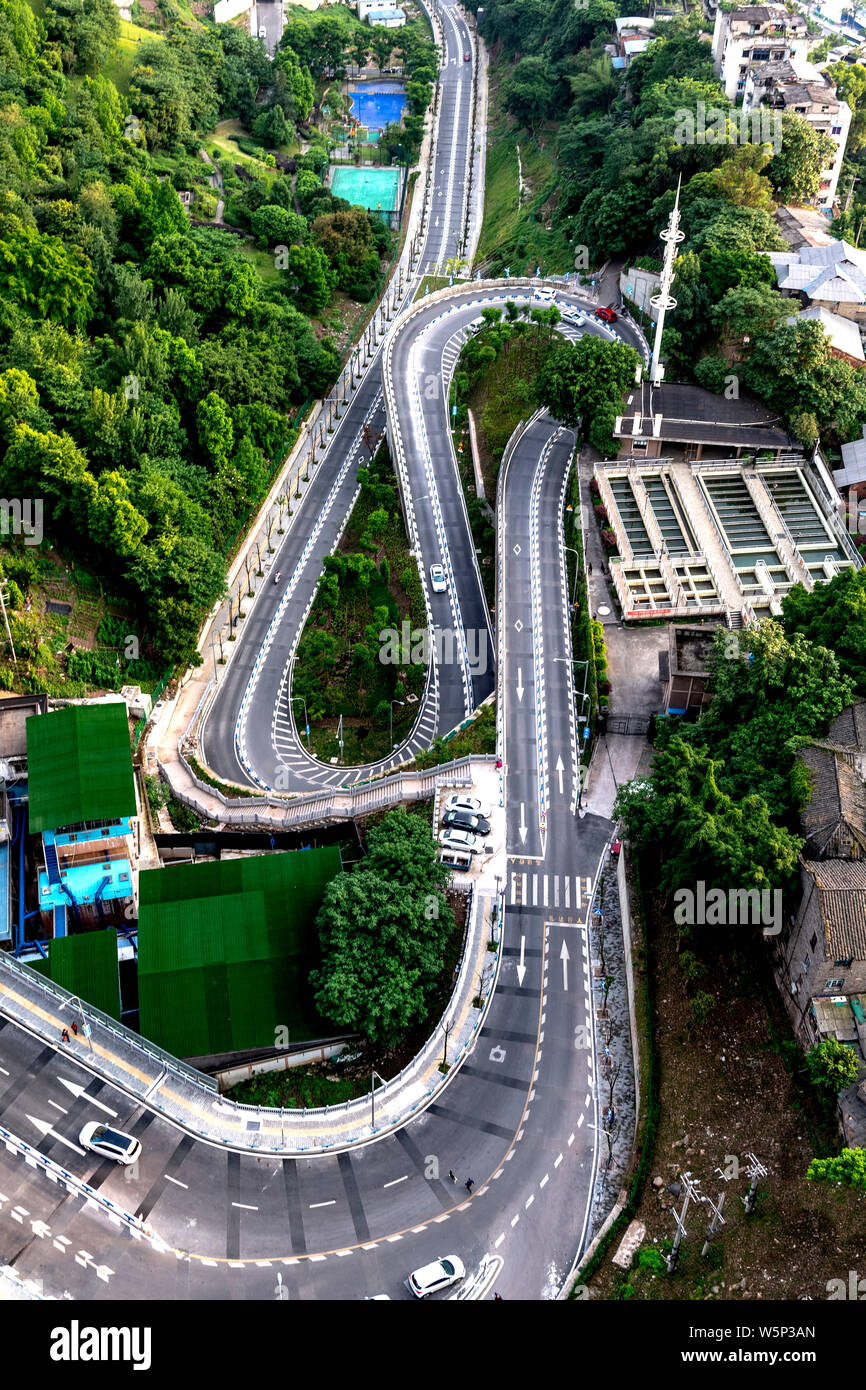 Aerial view of a stunning spiral highway, which is part of the city's ...