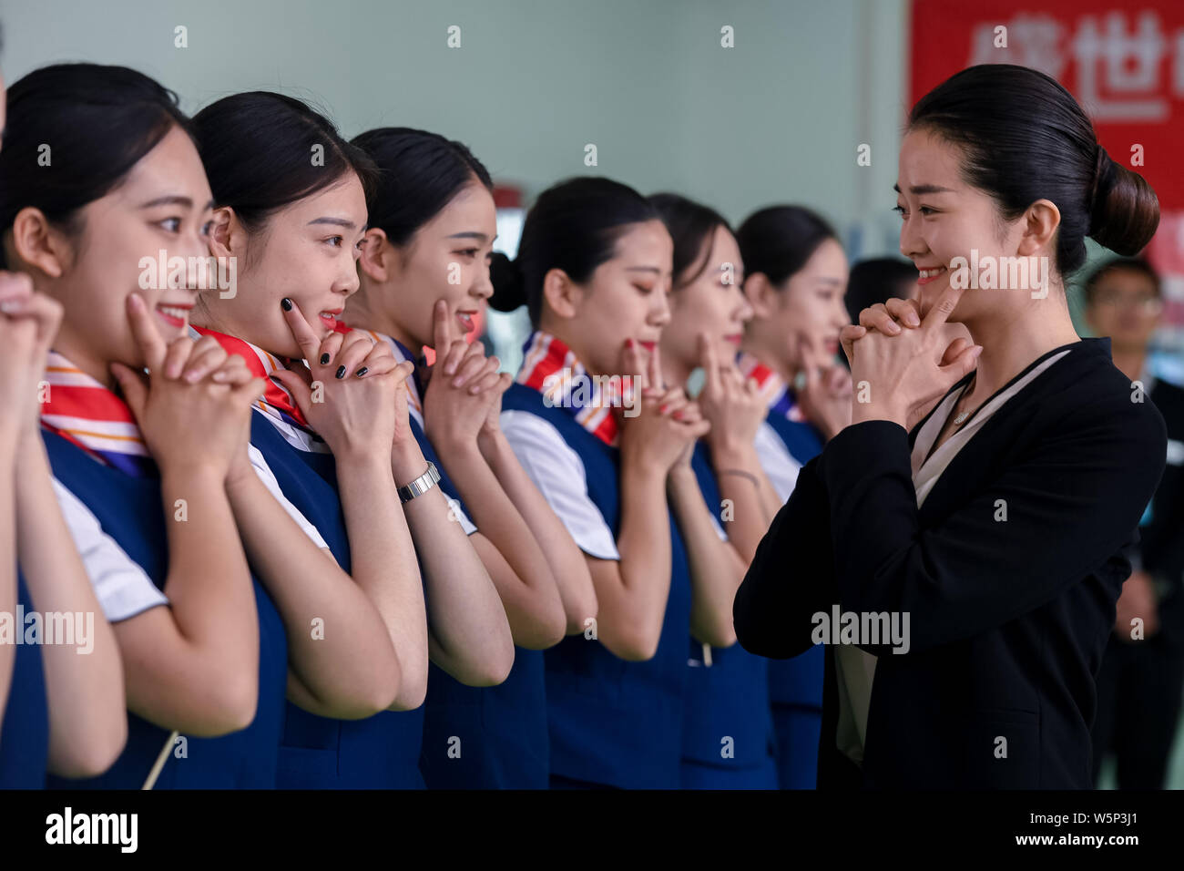 Smiling youth china hi-res stock photography and images - Alamy