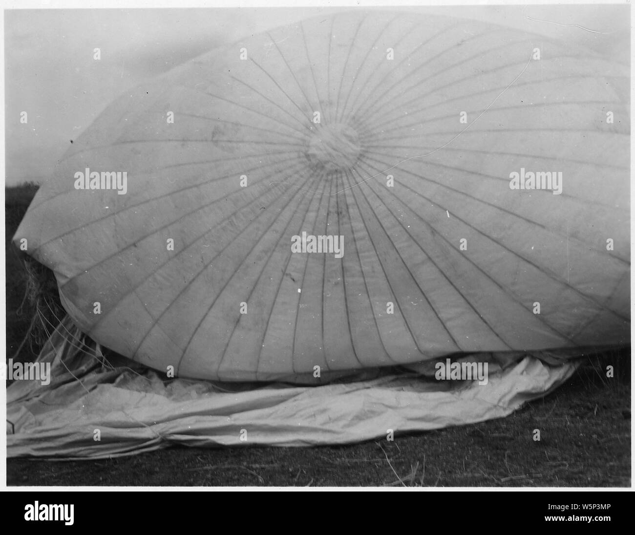 Japanese war balloon; Scope and content: Collapsed balloon on ground ...