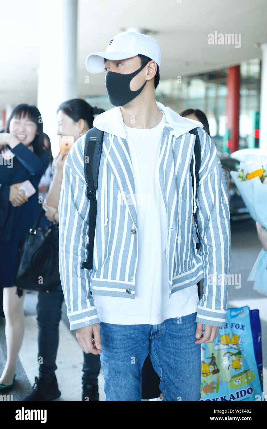 Hong Kong actor and singer Raymond Lam arrives at the Beijing Capital ...