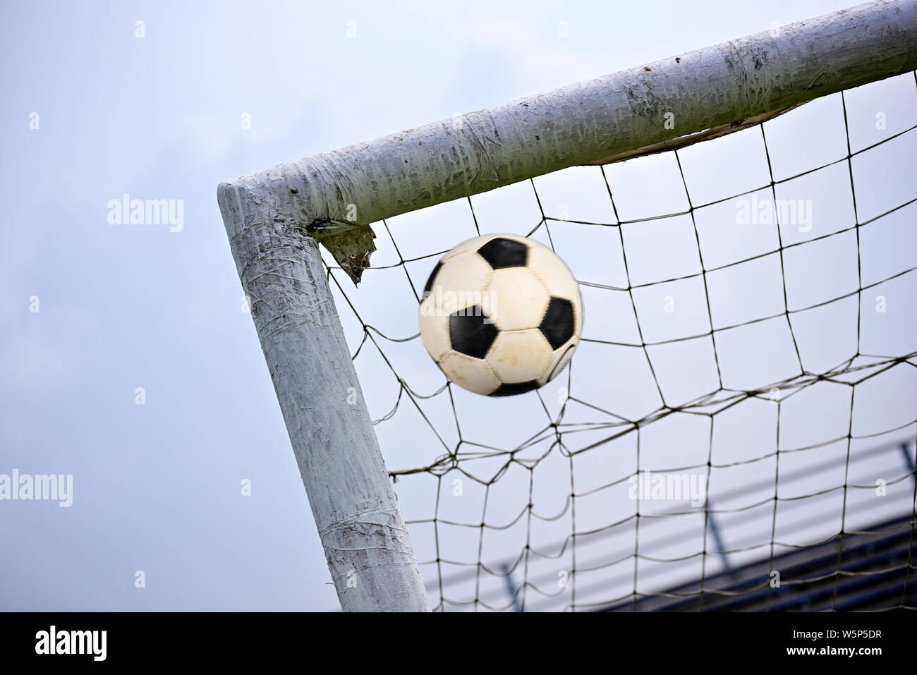 Scoring a goal, soccer ball tend to enter soccer goal Stock Photo - Alamy
