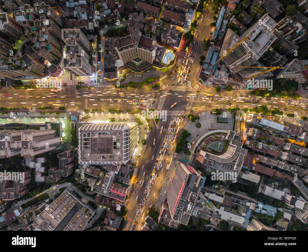 --FILE--An aerial night view of clusters of buildings and houses in ...