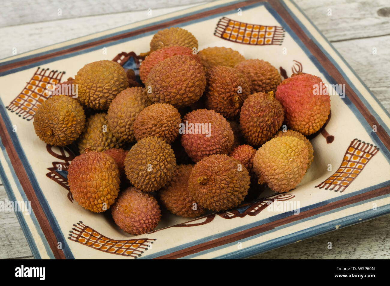 Tropical fruit lychee in the bowl Stock Photo - Alamy