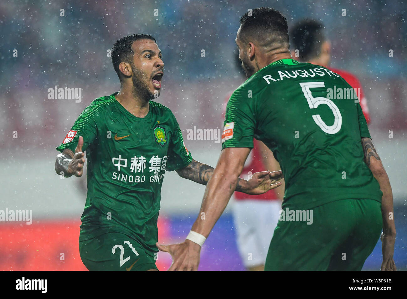 Spanish football player Jonathan Viera, left, of Beijing Sinobo Guoan ...