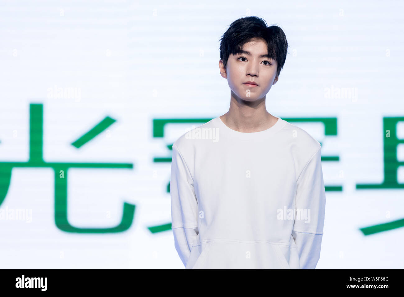 Karry Wang Jun Kai of Chinese boy group TFBoys attends a promotional event for washing powder ...