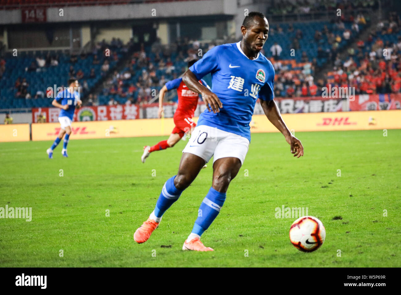 Cameroonian football player Christian Bassogog of Henan Jianye dribbles ...