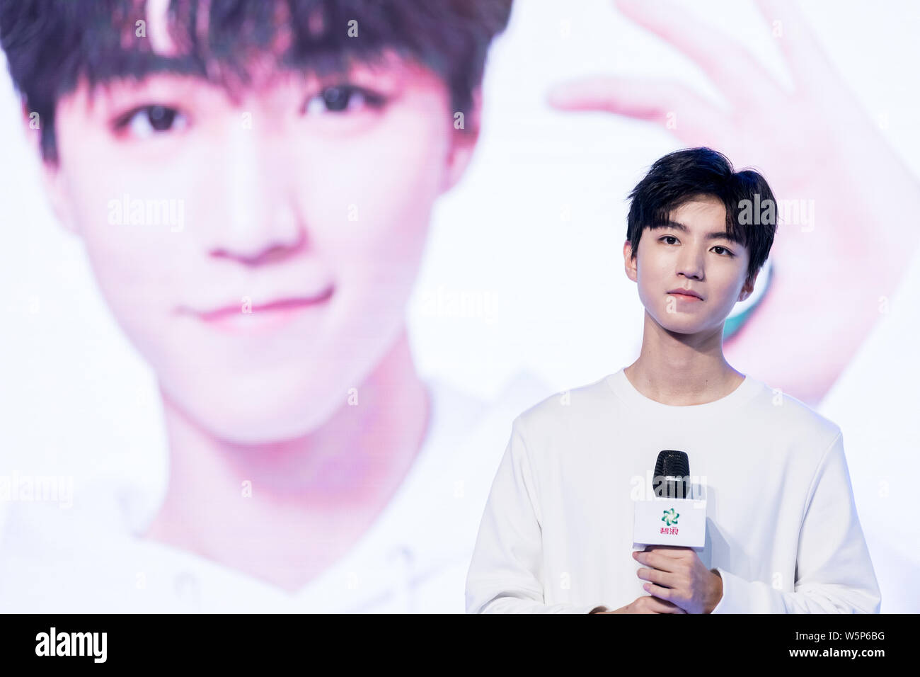 Karry Wang Jun Kai of Chinese boy group TFBoys attends a promotional ...