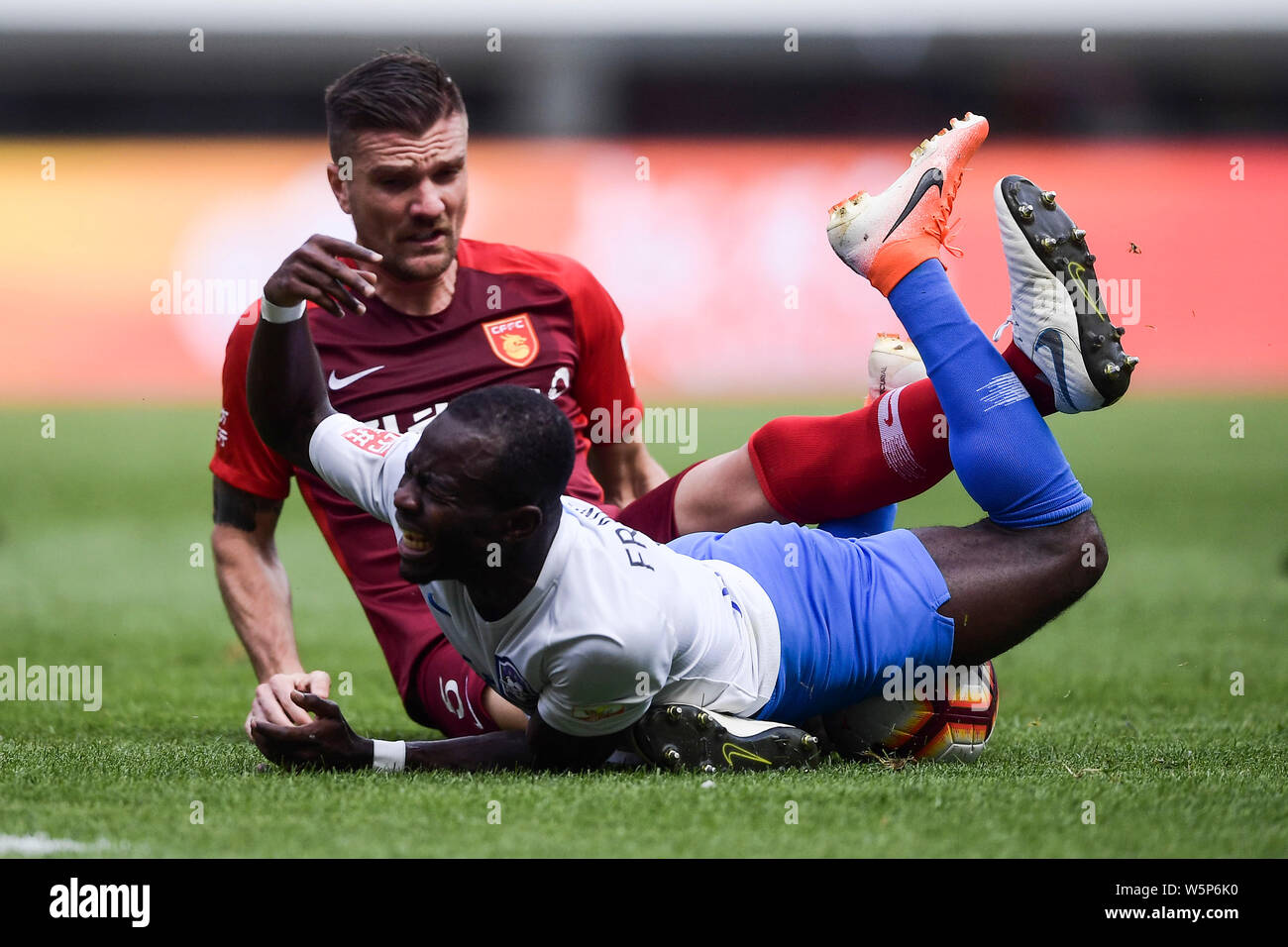 Hong Kong football player Andy Russell, left, of Hebei China Fortune ...