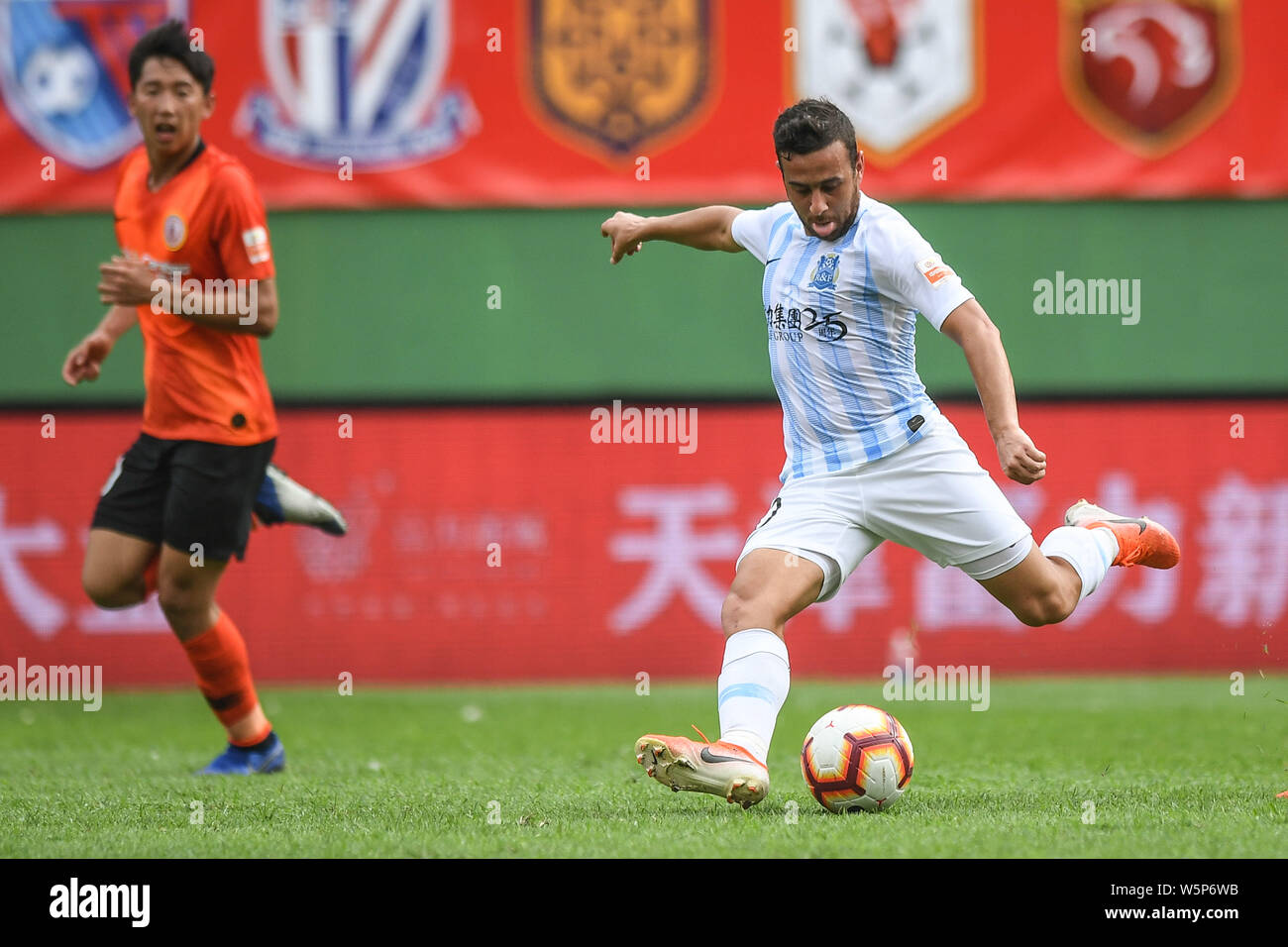 Israeli-Arab football player Dia Saba of Guangzhou R&F shots the ball ...