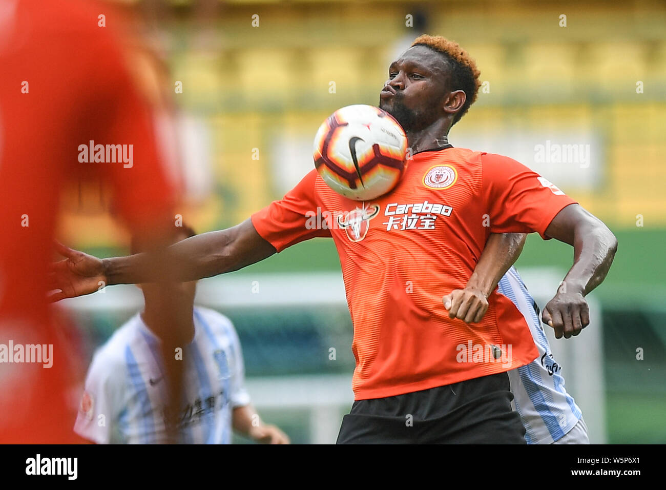 Senegalese football player Makhete Diop of Beijing Renhe dribbles ...