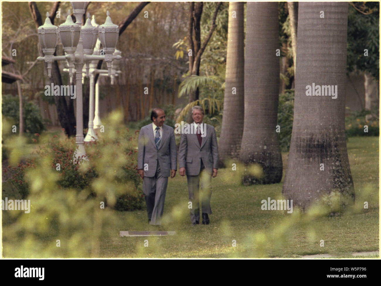 Jimmy Carter and President Carlos Perez tour the grounds at La Casona ...