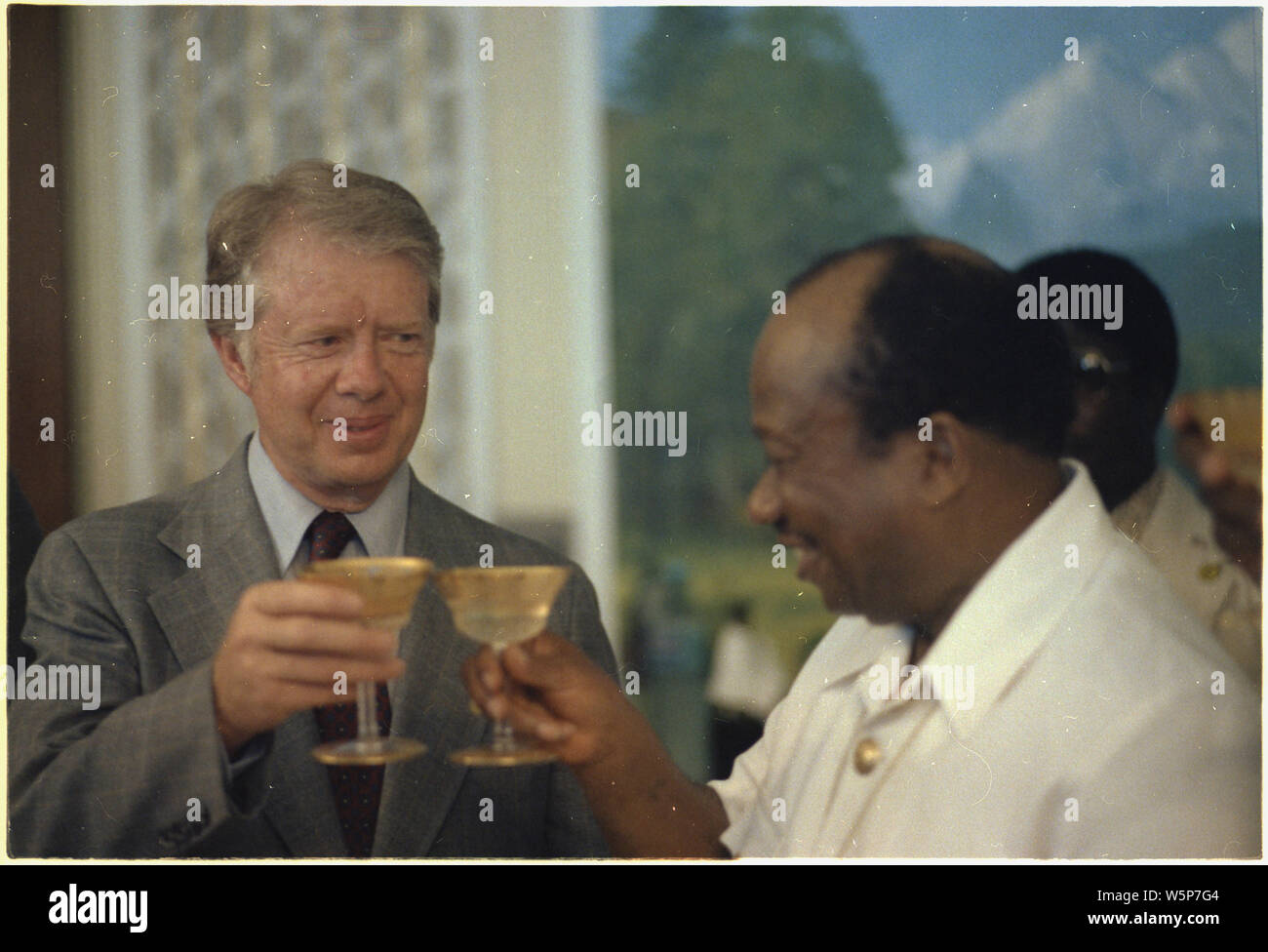 Jimmy Carter and President William Tolbert of Liberia engage in a toast ...