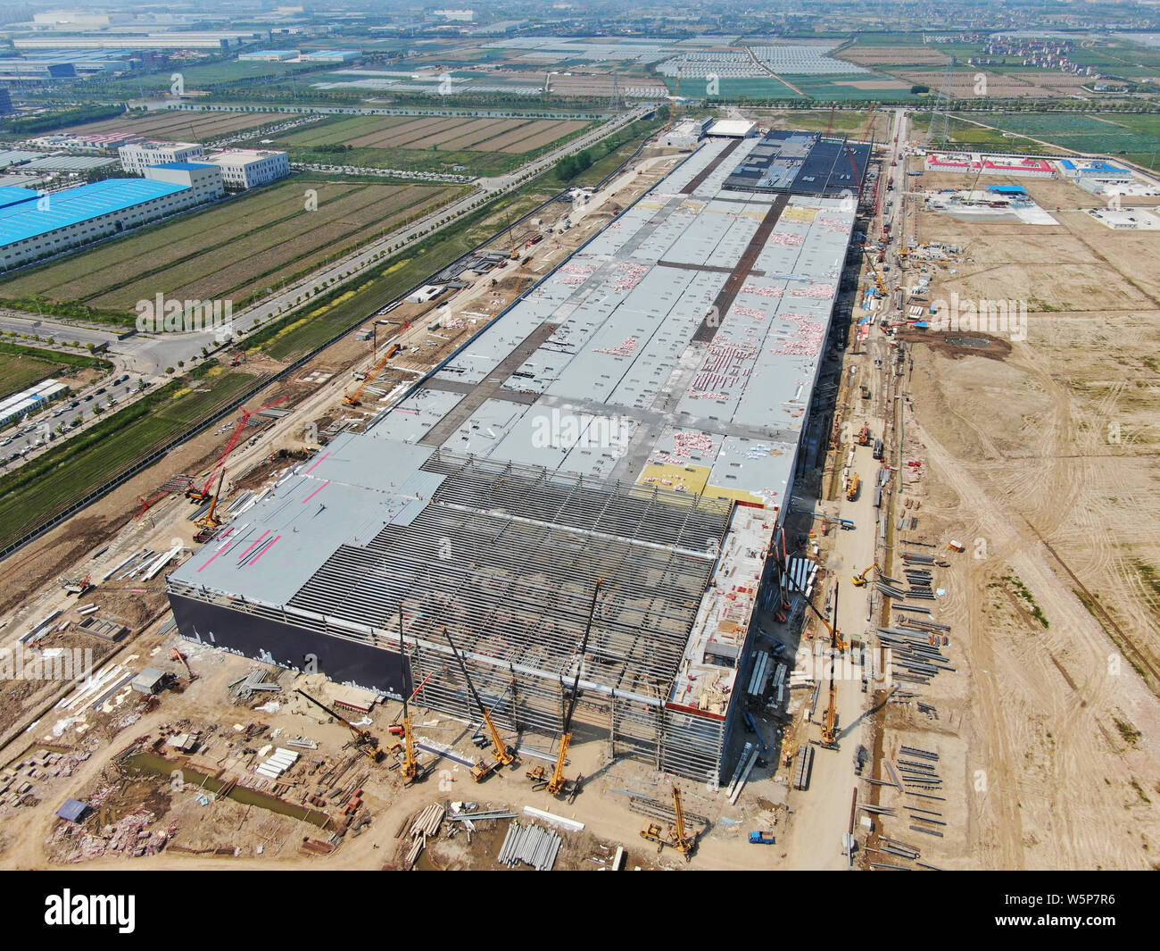 Aerial view of the Tesla Shanghai Gigafactory under construction in ...