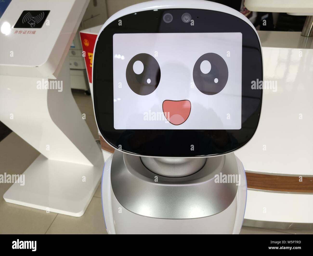 A cute smart guiding robot is seen at a government affair hall in ...