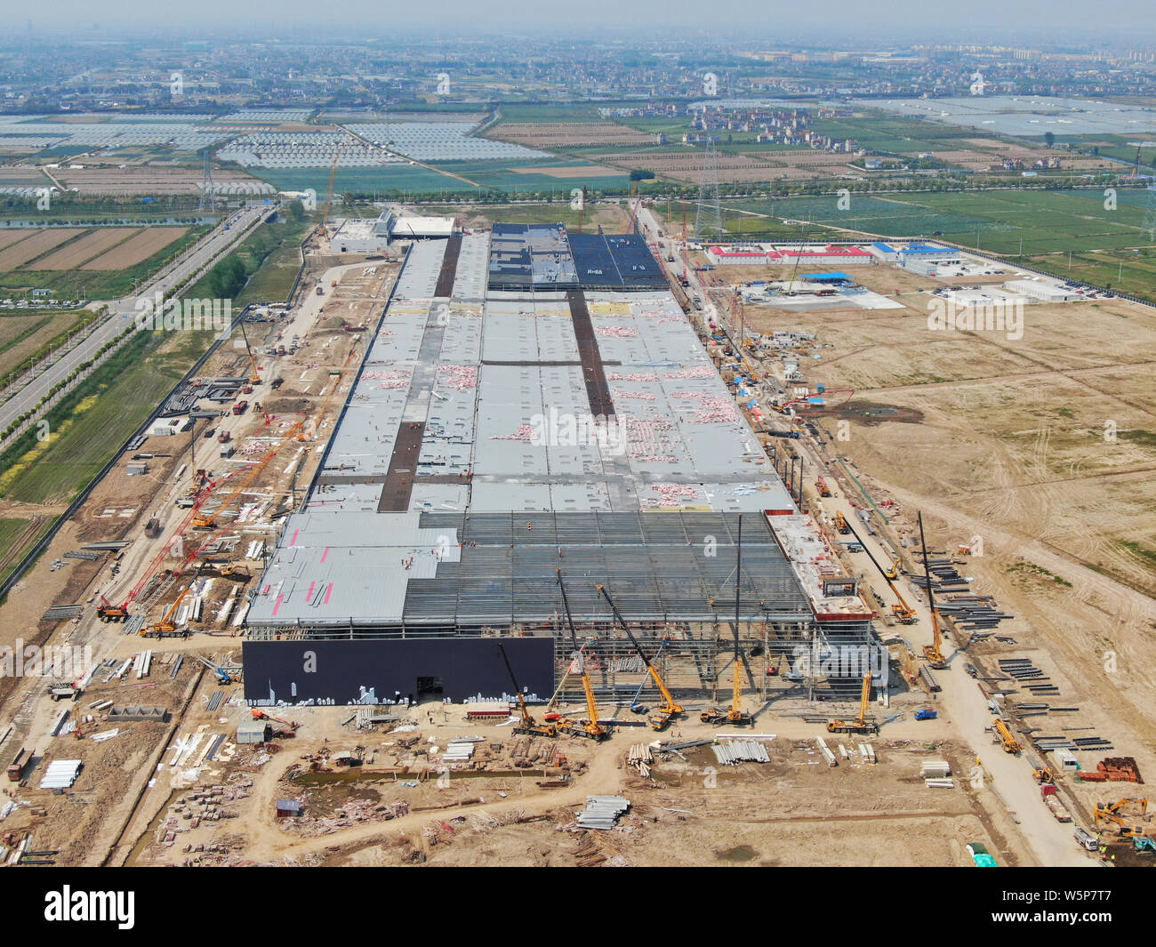 Aerial view of the Tesla Shanghai Gigafactory under construction in ...