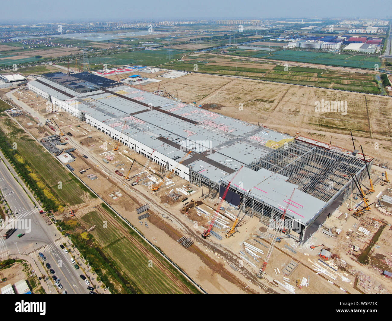Aerial view of the Tesla Shanghai Gigafactory under construction in ...