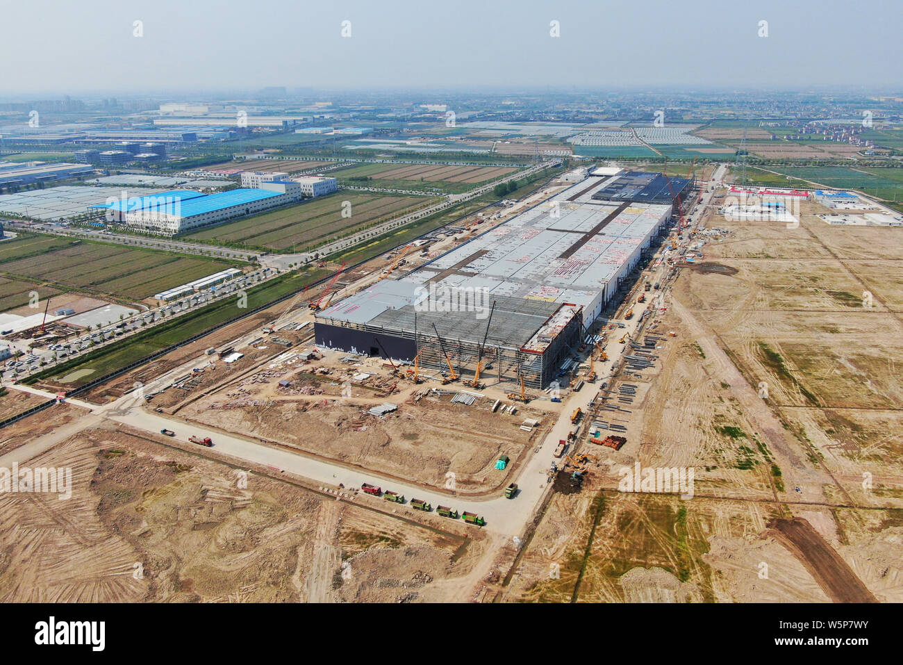 Aerial view of the Tesla Shanghai Gigafactory under construction in ...