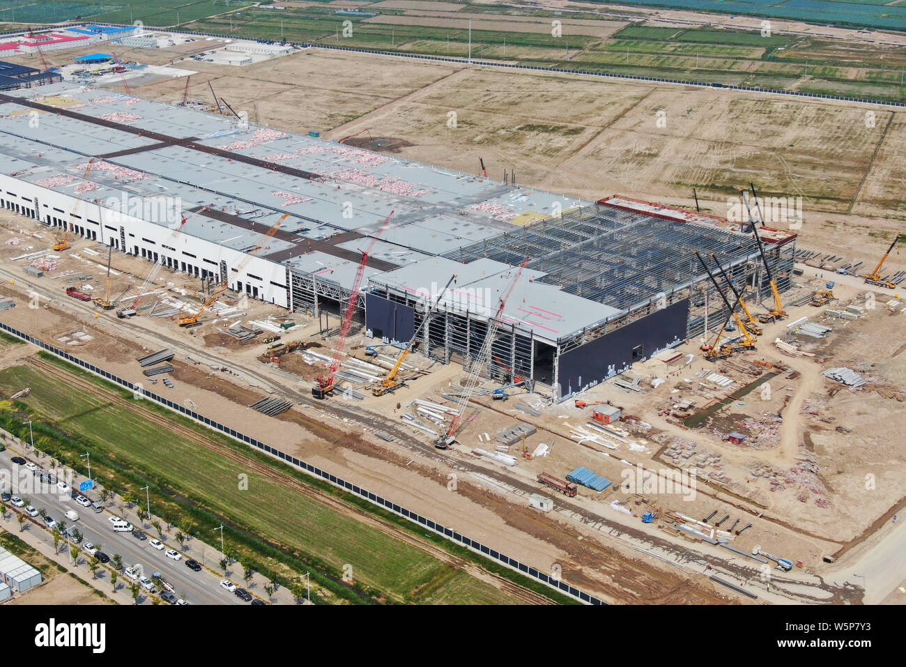 Aerial view of the Tesla Shanghai Gigafactory under construction in ...