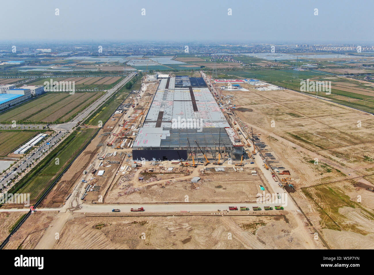 Aerial view of the Tesla Shanghai Gigafactory under construction in ...