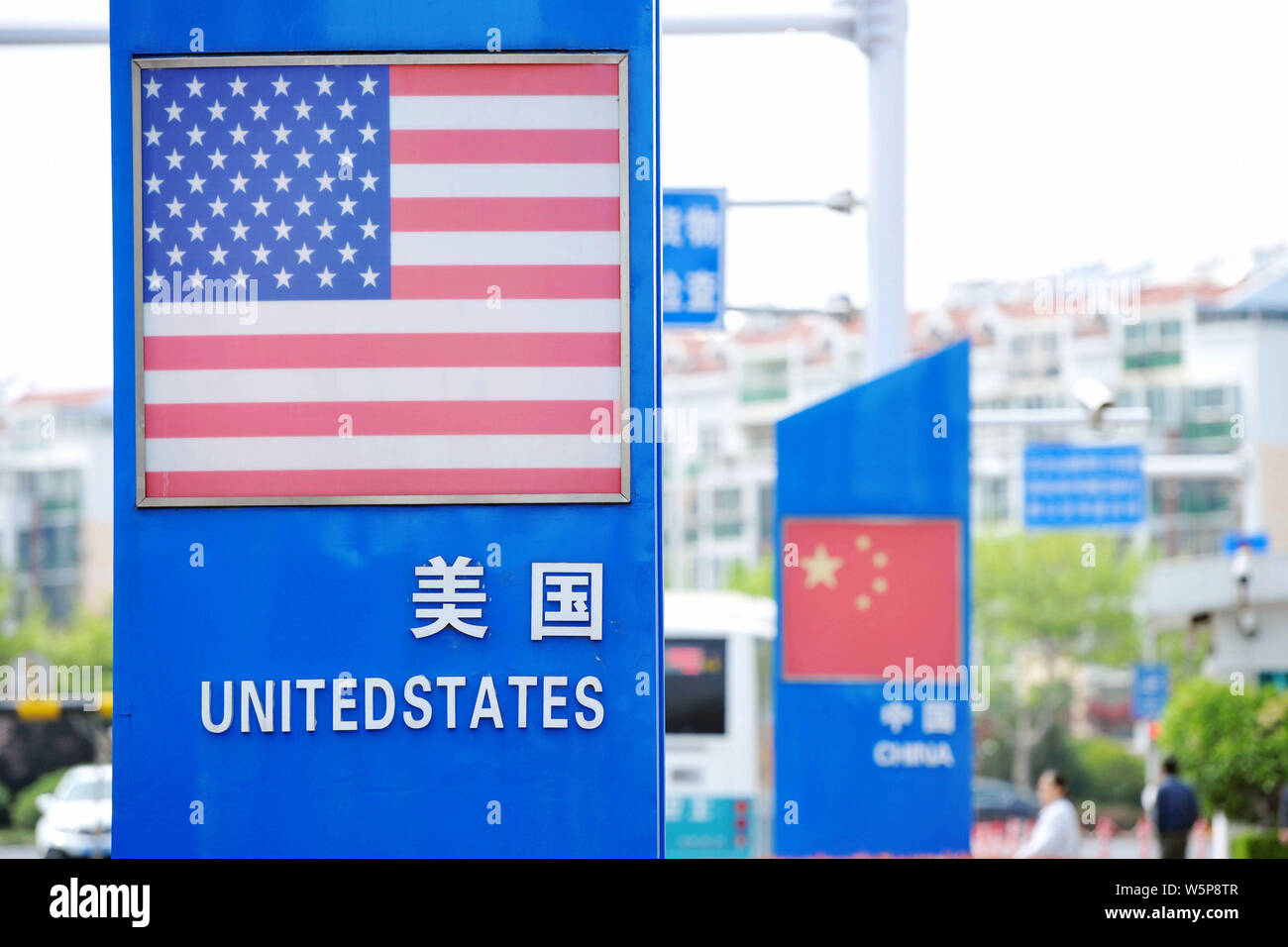 --FILE--Signboards showing the flag of the United States and Chinese ...