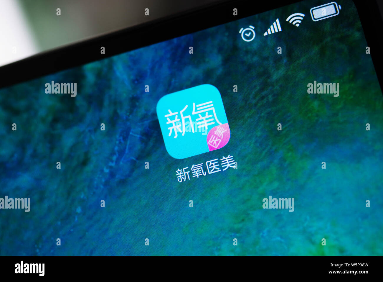 A netizen browses the mobile app of Chinese online platform for medical ...