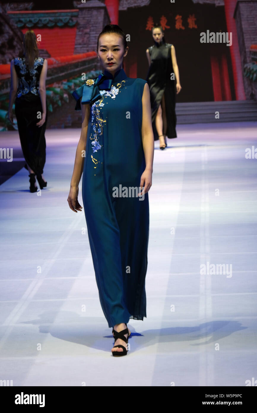 A model dressed in Cheongsam, a traditional Chinese dresses also known ...