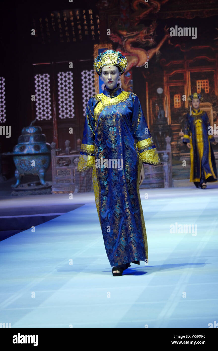 A model dressed in Cheongsam, a traditional Chinese dresses also known ...