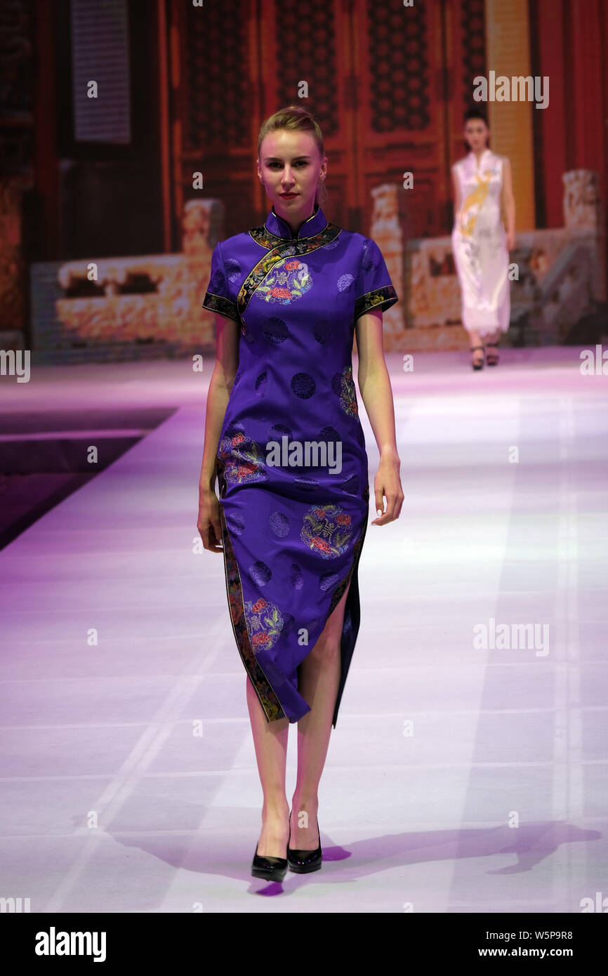 A model dressed in Cheongsam, a traditional Chinese dresses also known ...
