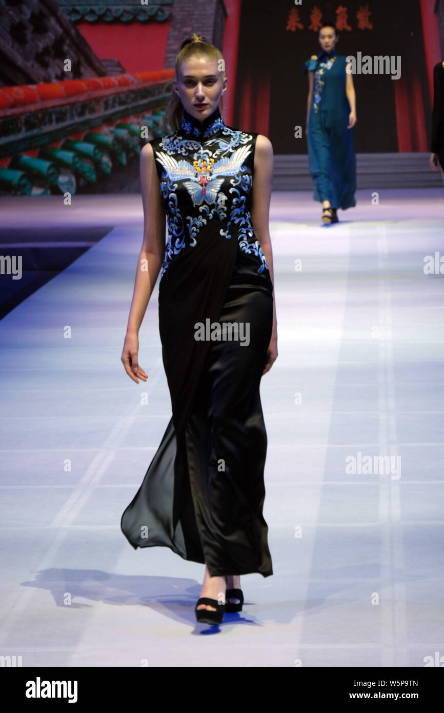 A model dressed in Cheongsam, a traditional Chinese dresses also known ...